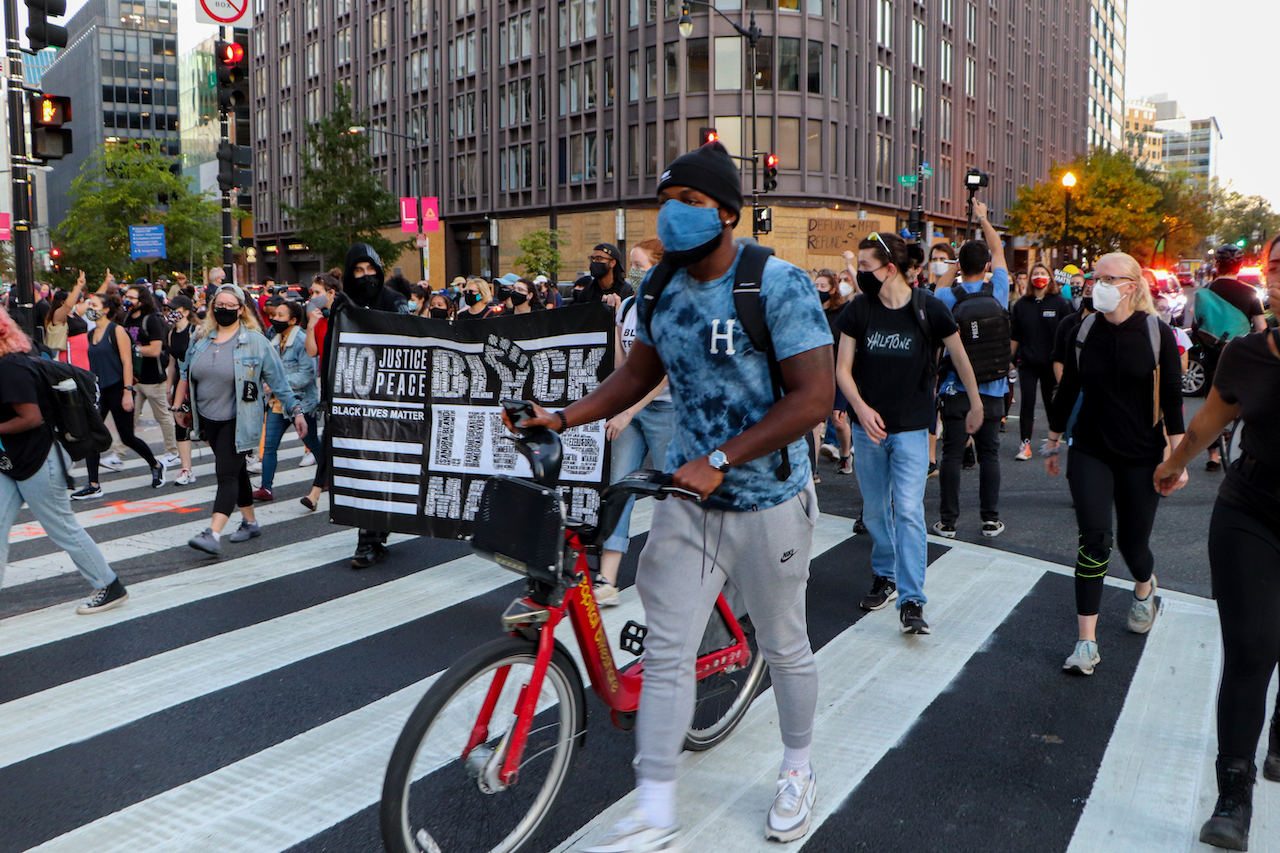 Protesters take to BLM Plaza to remind Biden supporters the work is not ...